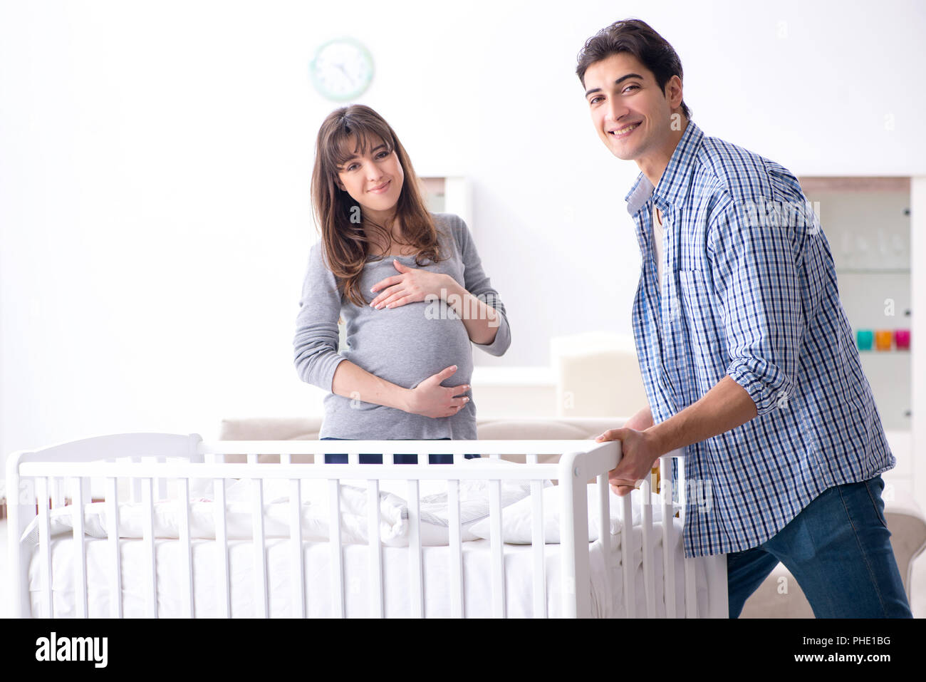 Young parents expecting their first baby Stock Photo - Alamy