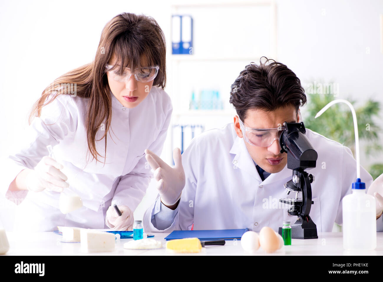 Two lab doctor testing food products Stock Photo - Alamy