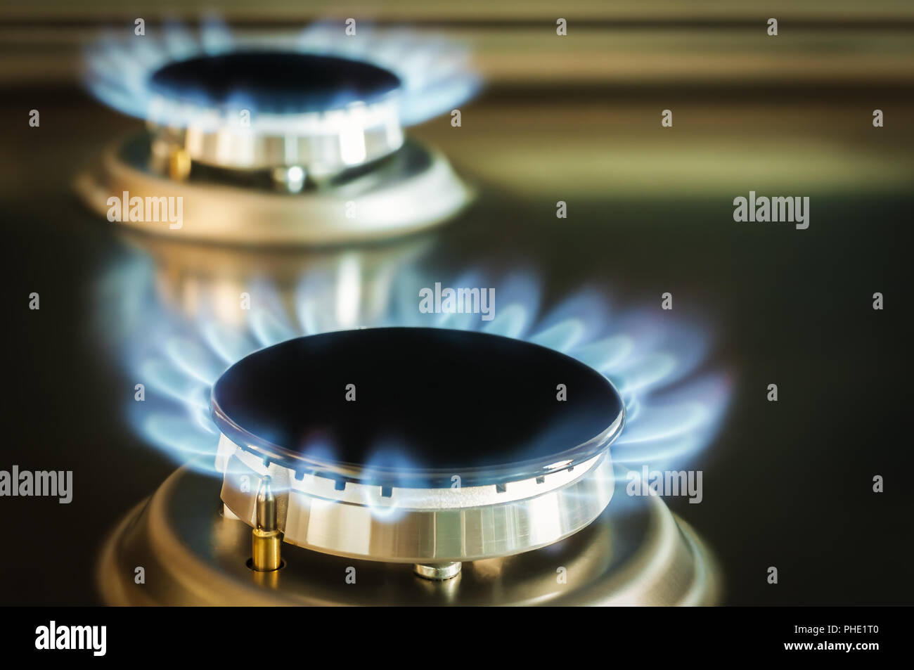 Gas flame of a gas stove in stainless steel Stock Photo - Alamy