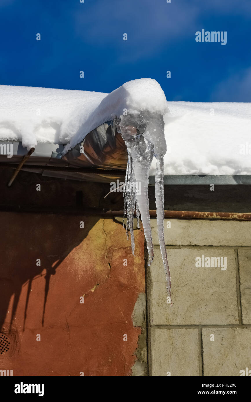 Ice snow drip from roof hi-res stock photography and images - Alamy