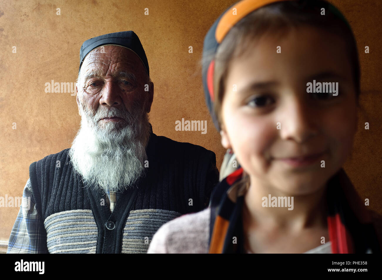 Muslim man and girl from the Uzbek ethnic group ( Kyrgyzstan Stock ...