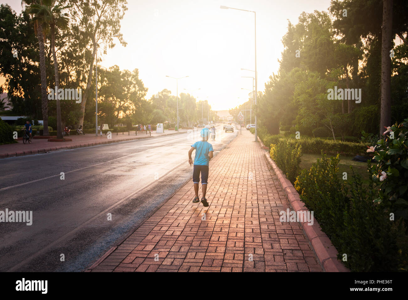 Kid boy walking Stock Photo - Alamy