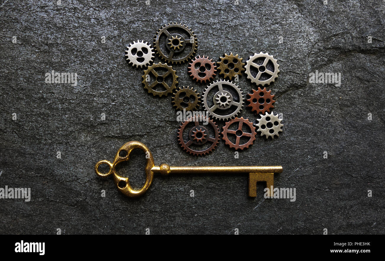 Gears and key Stock Photo - Alamy