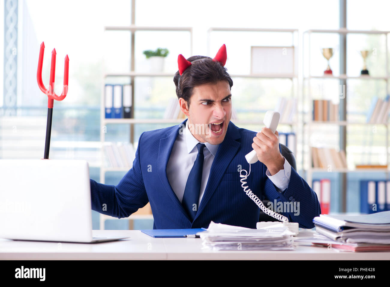 Devil angry businessman in the office Stock Photo - Alamy