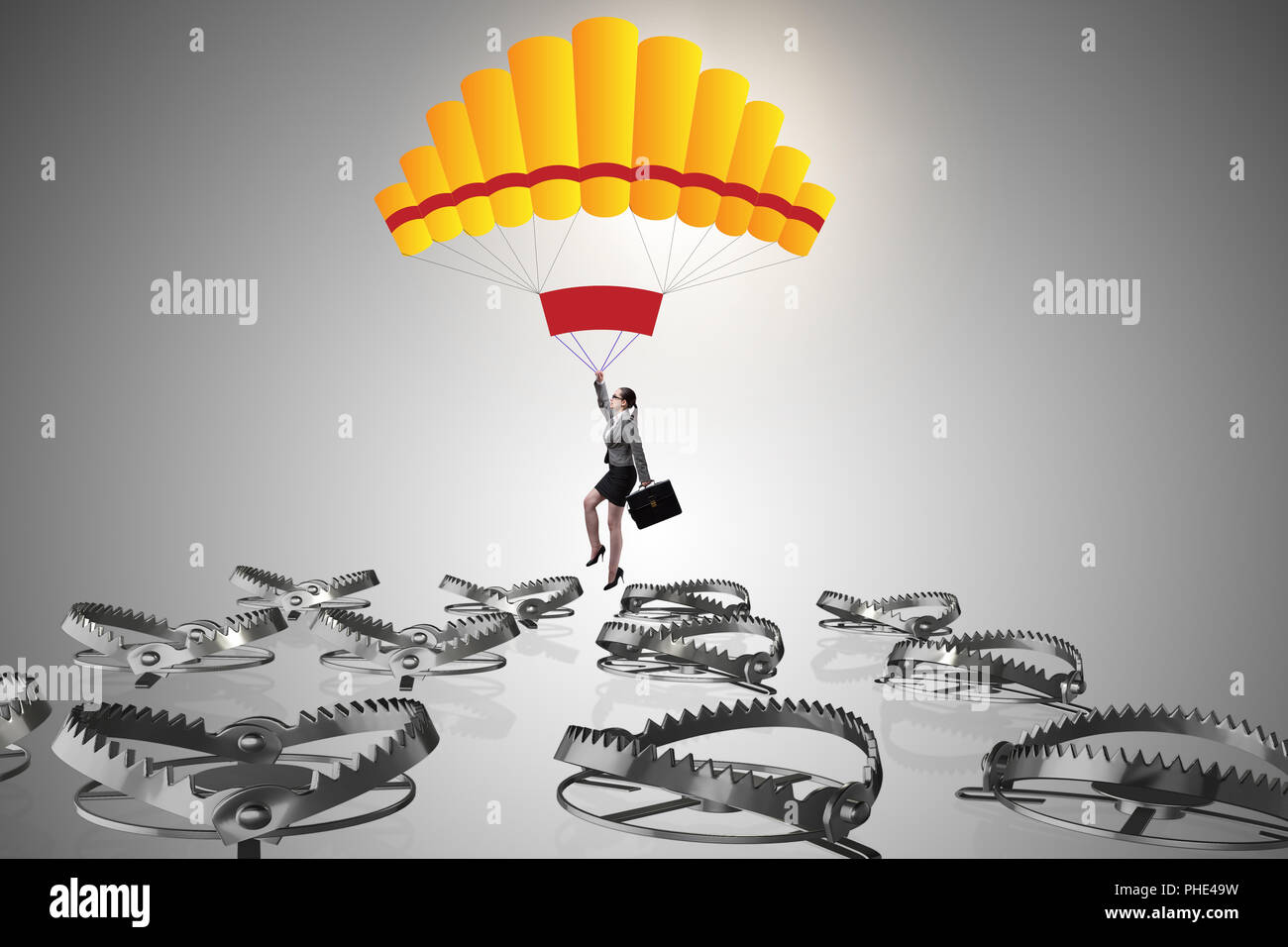 Businesswoman falling into trap on parachute Stock Photo - Alamy
