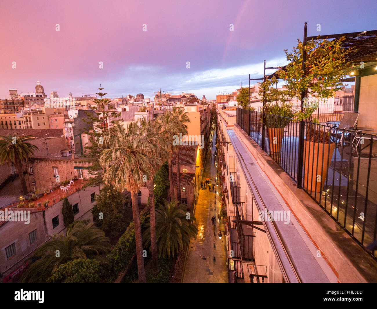 Rainbow over Barcelona sunset after rain, Spain from rooftop patio ...