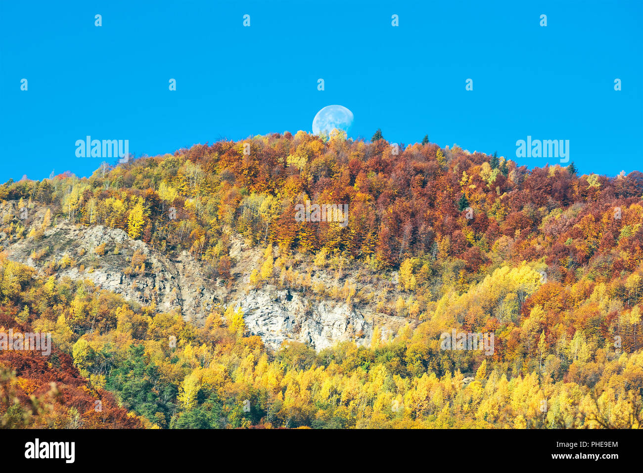 Big full moon above the mountain Stock Photo - Alamy