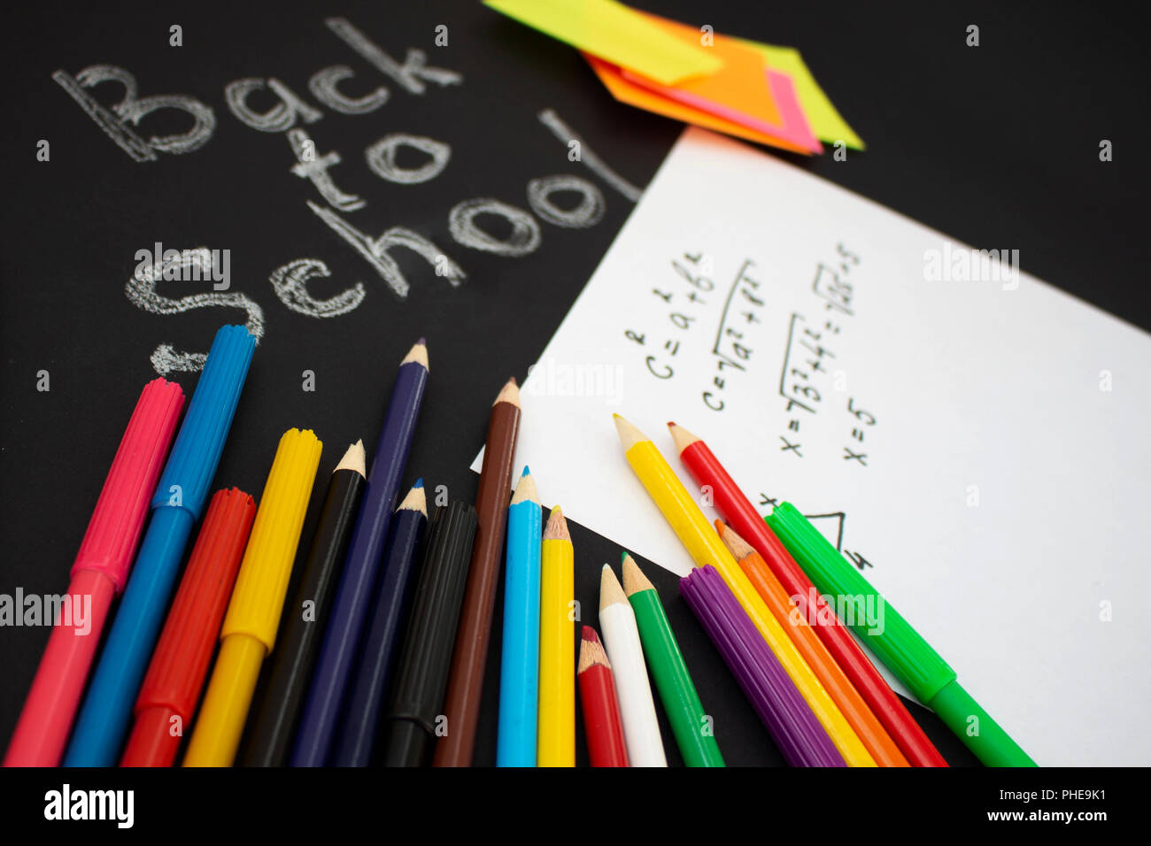 Back to school flat lay. Colour pencils, stickers and lesson notes on ...