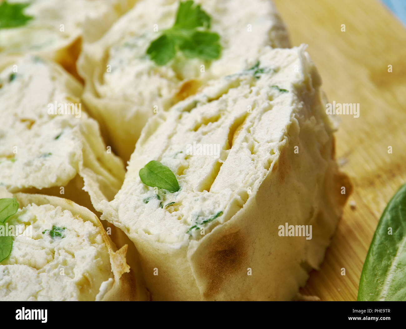 Lavash with feta cheese and greens Stock Photo - Alamy
