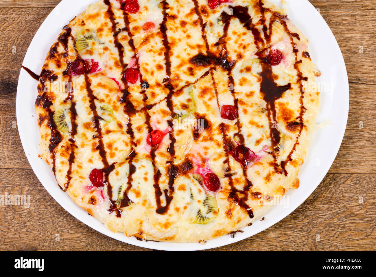 Sweet pizza with fruits and mozzarella Stock Photo - Alamy