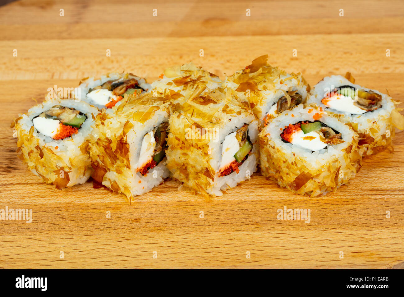 Roll with eel and tuna chip Stock Photo - Alamy
