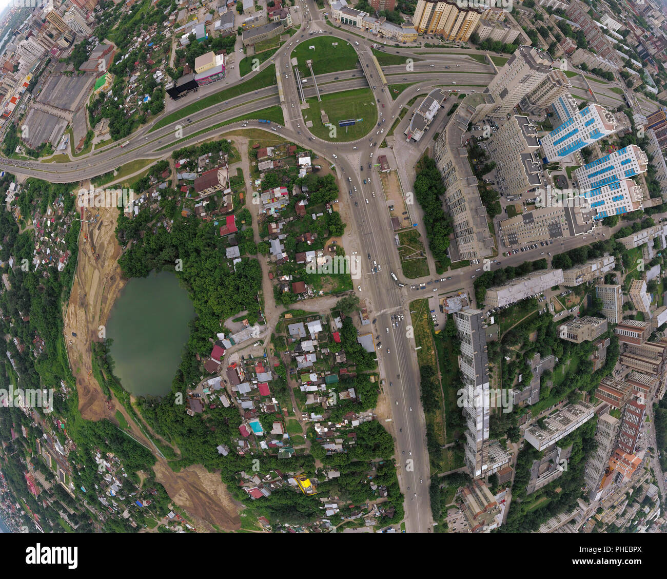 Aerial view of square in the city with roundabout traffic, streets and ...