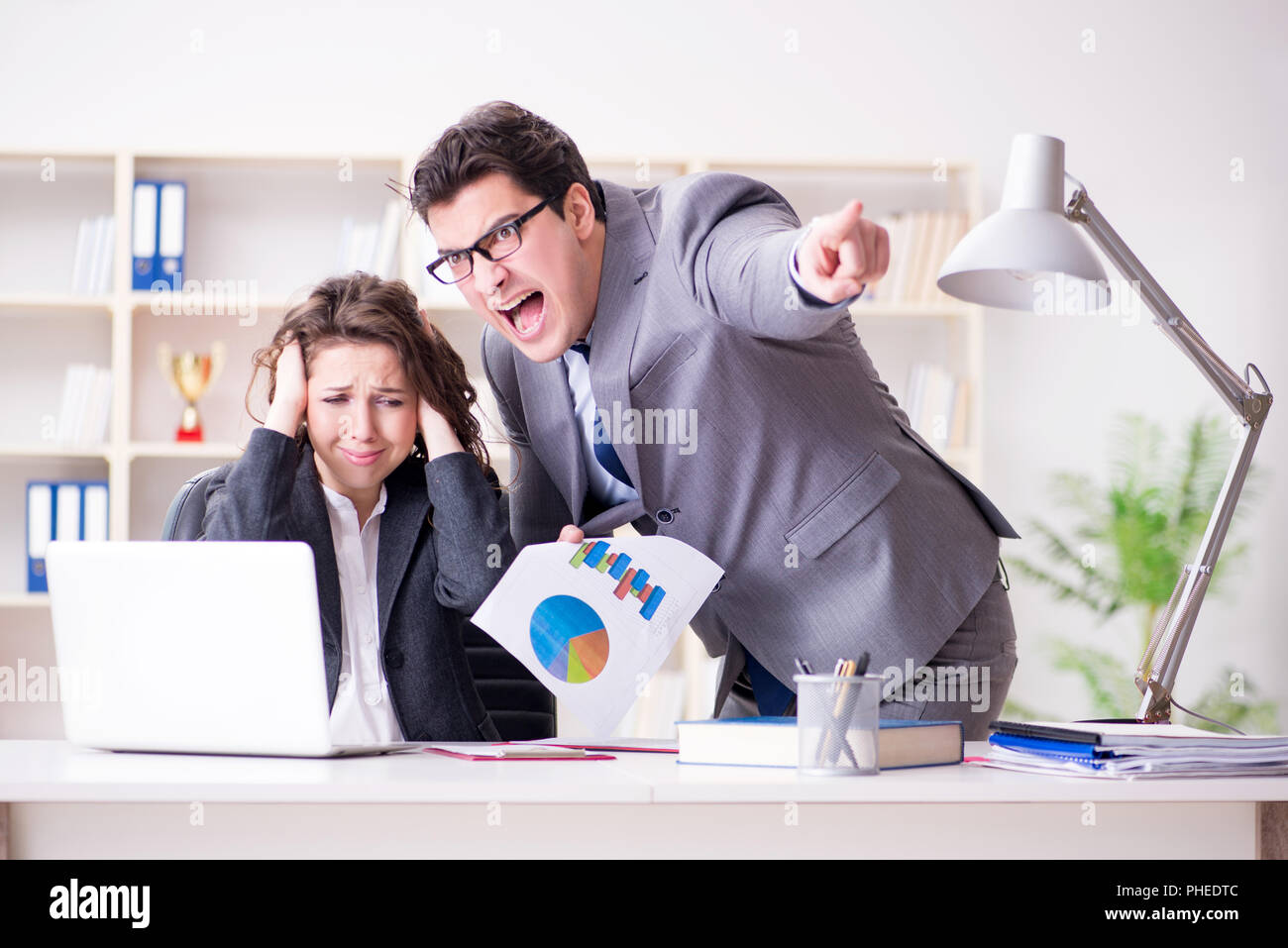 Angry boss unhappy with female employee performance Stock Photo - Alamy