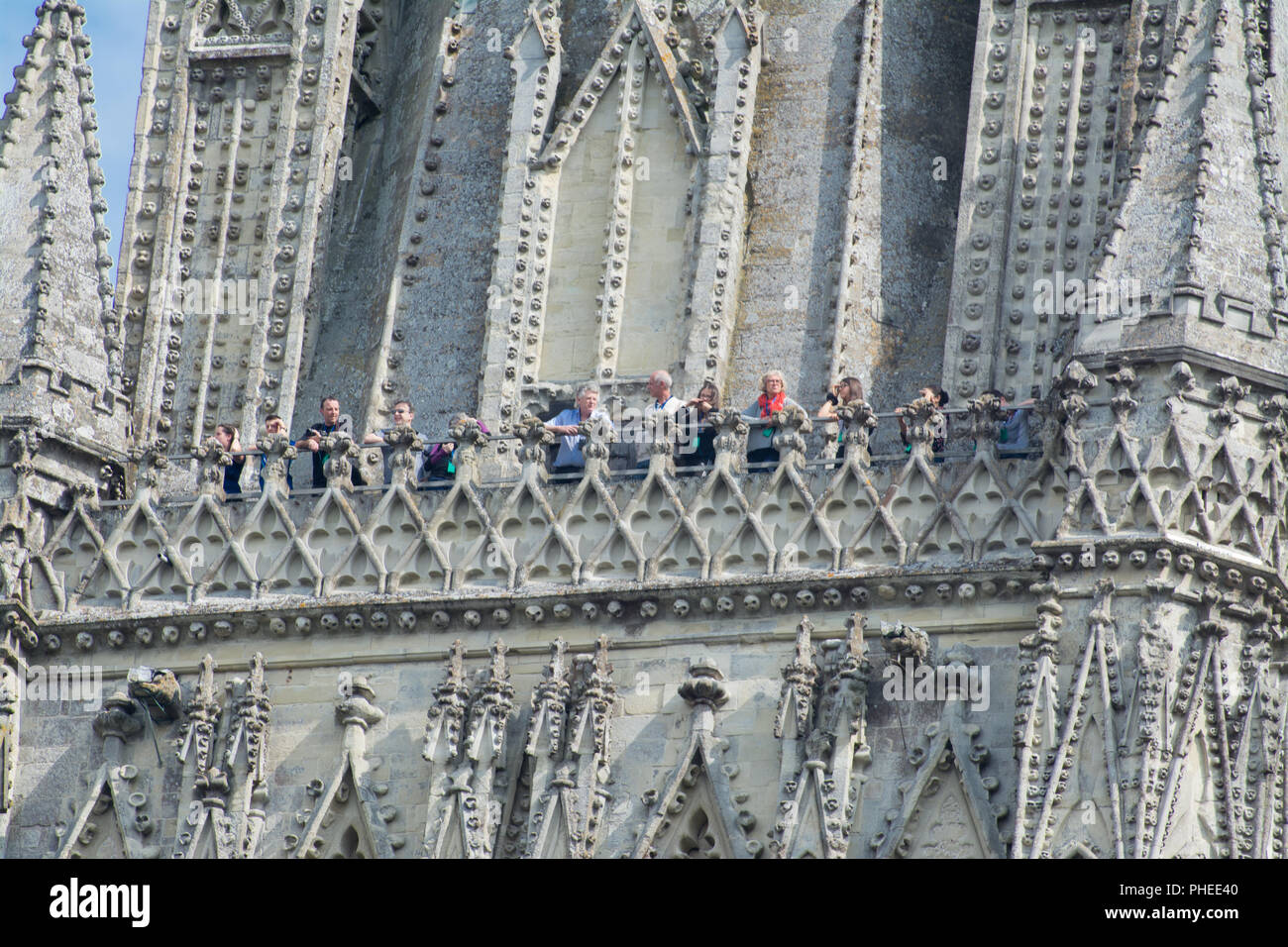 Tourists looking down from Britain's tallest spire at Salisbury ...