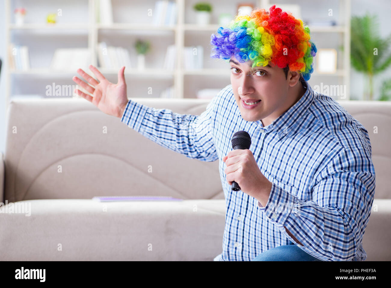 Funny man singing songs in karaoke at home Stock Photo - Alamy