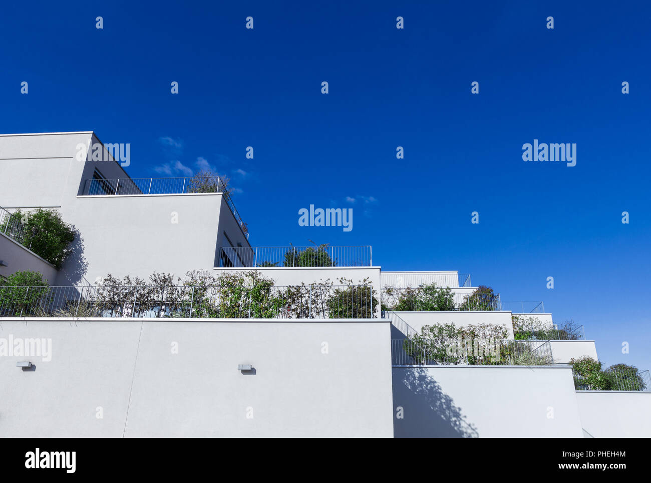 Grey apartment building with modern architecture Stock Photo - Alamy