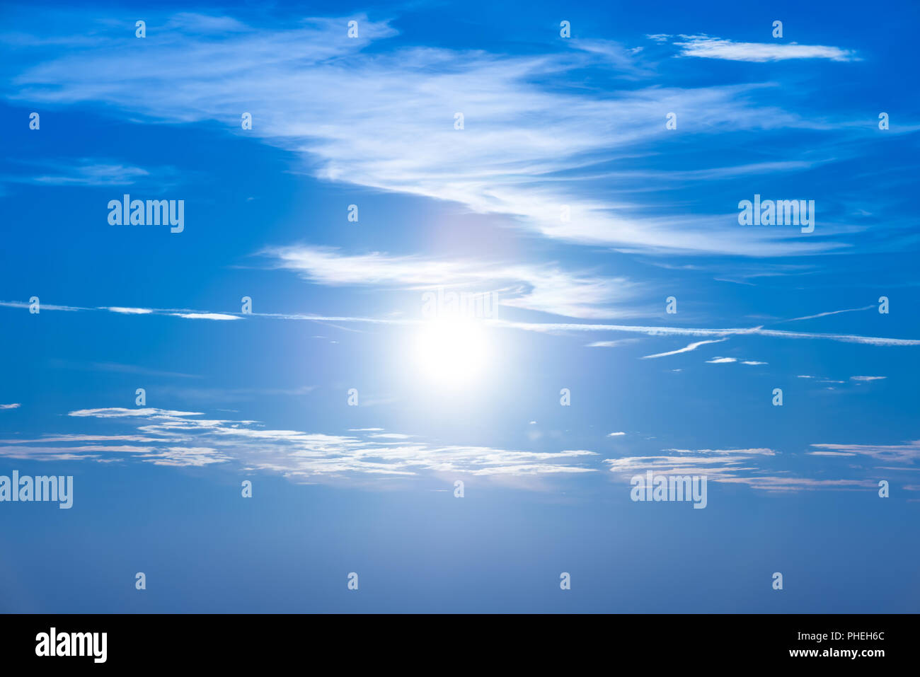 Sunset in the sky with blue clouds Stock Photo - Alamy