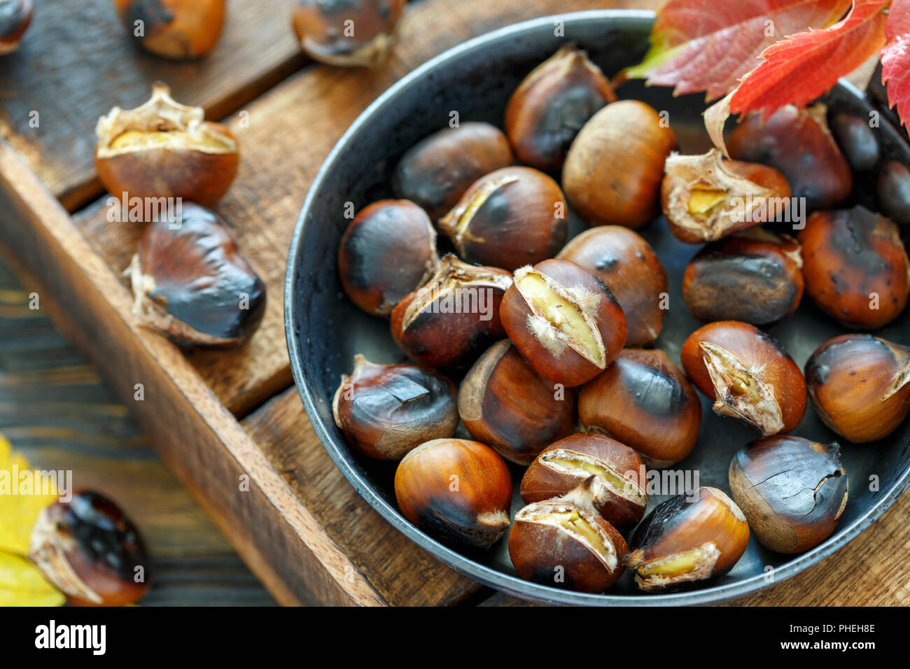 Roast chestnuts in a pan closeup Stock Photo - Alamy