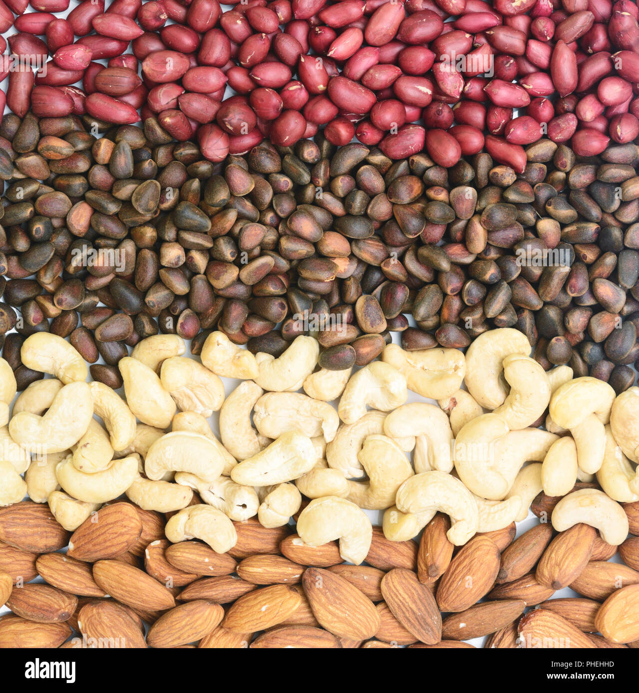 mixed nuts background Stock Photo - Alamy
