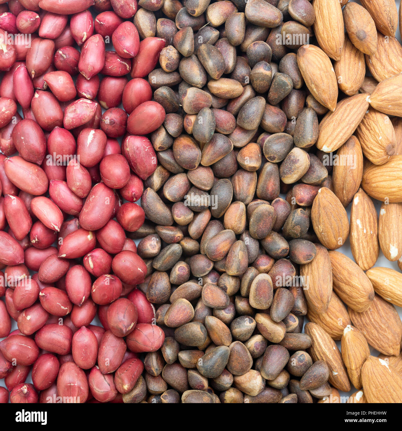 mixed nuts background Stock Photo - Alamy