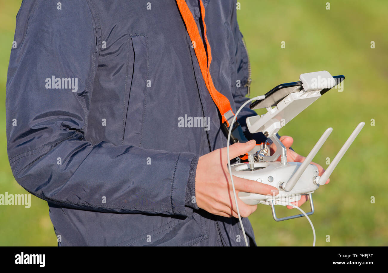 child operates a remote control for a drone Stock Photo - Alamy