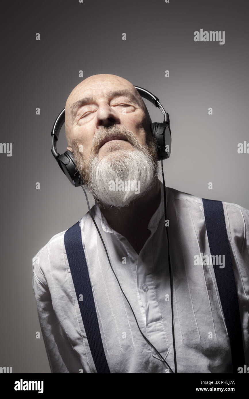 elderly male portrait with headphones Stock Photo - Alamy