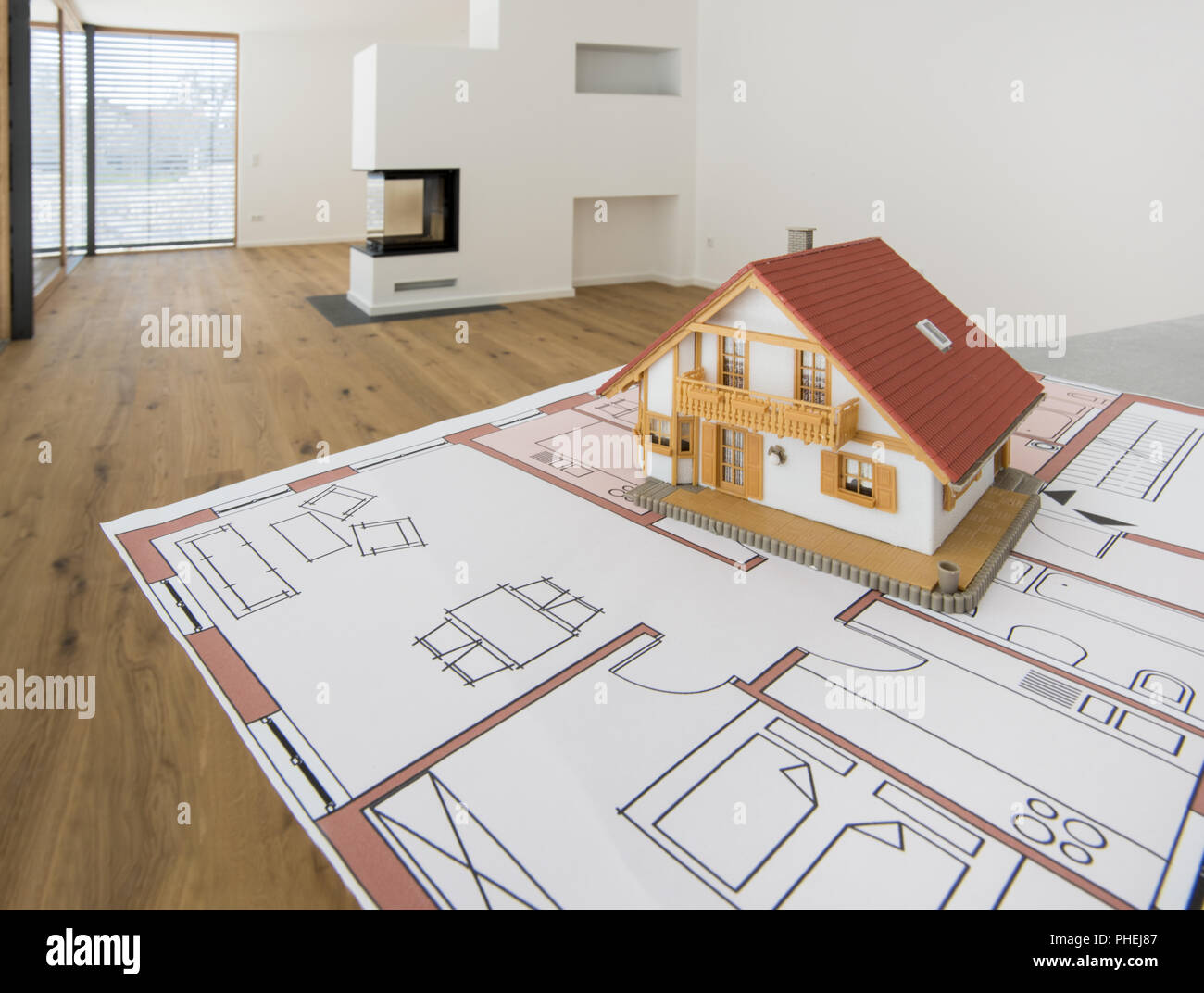 construction plan and model house in apartment Stock Photo - Alamy