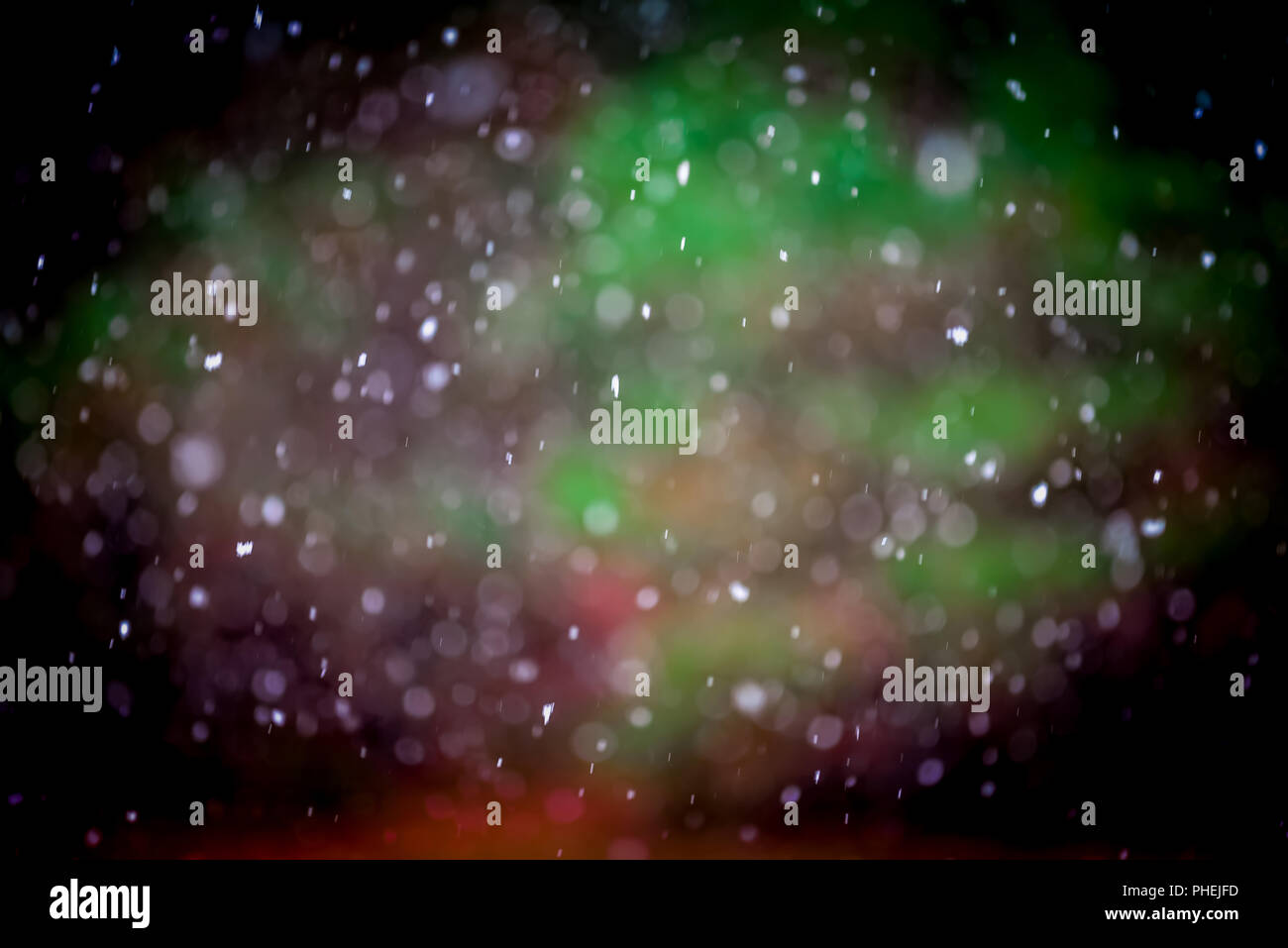 snow falling blur on forest background Stock Photo - Alamy