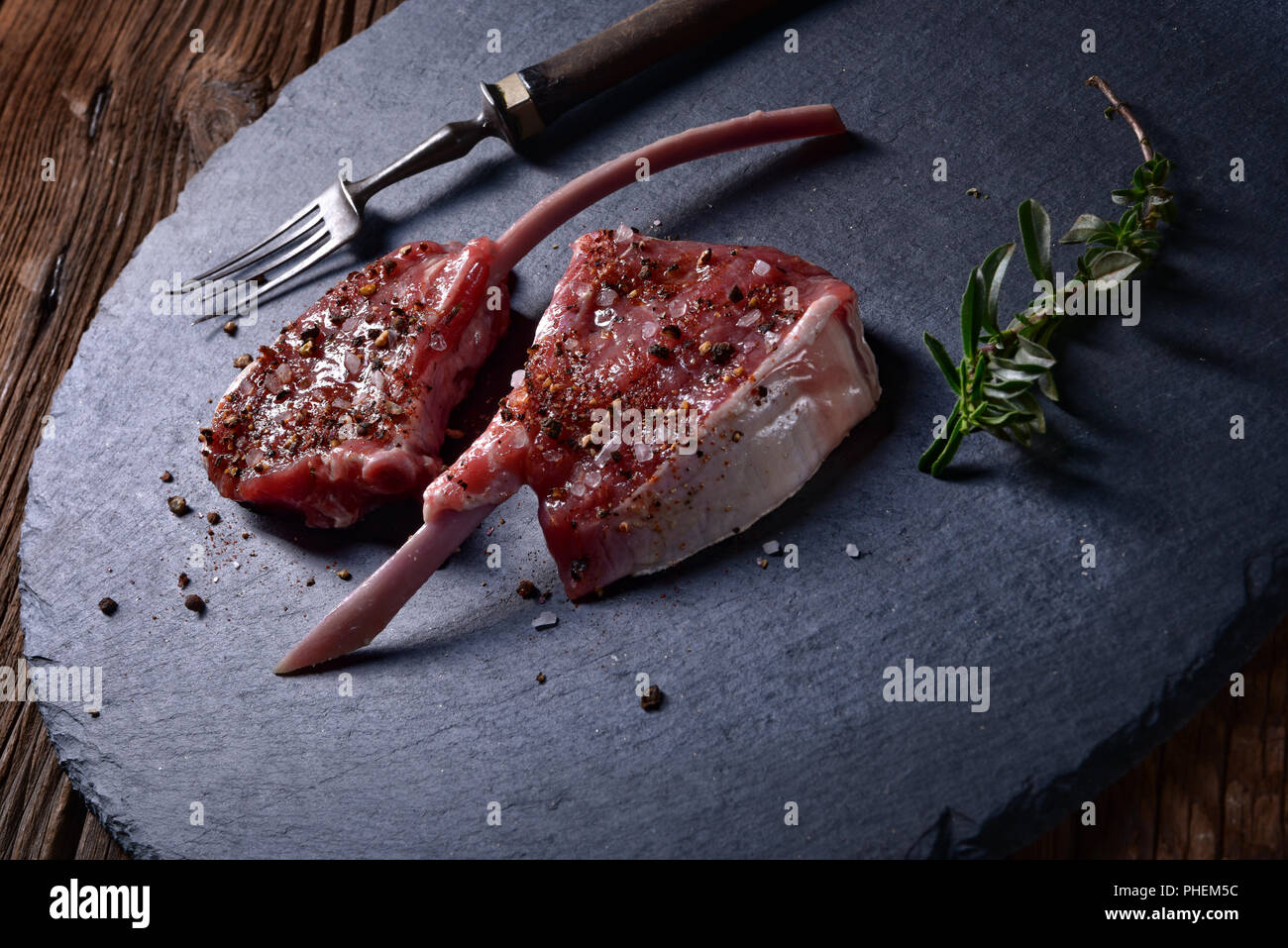 Raw cut rack of lamb Stock Photo - Alamy