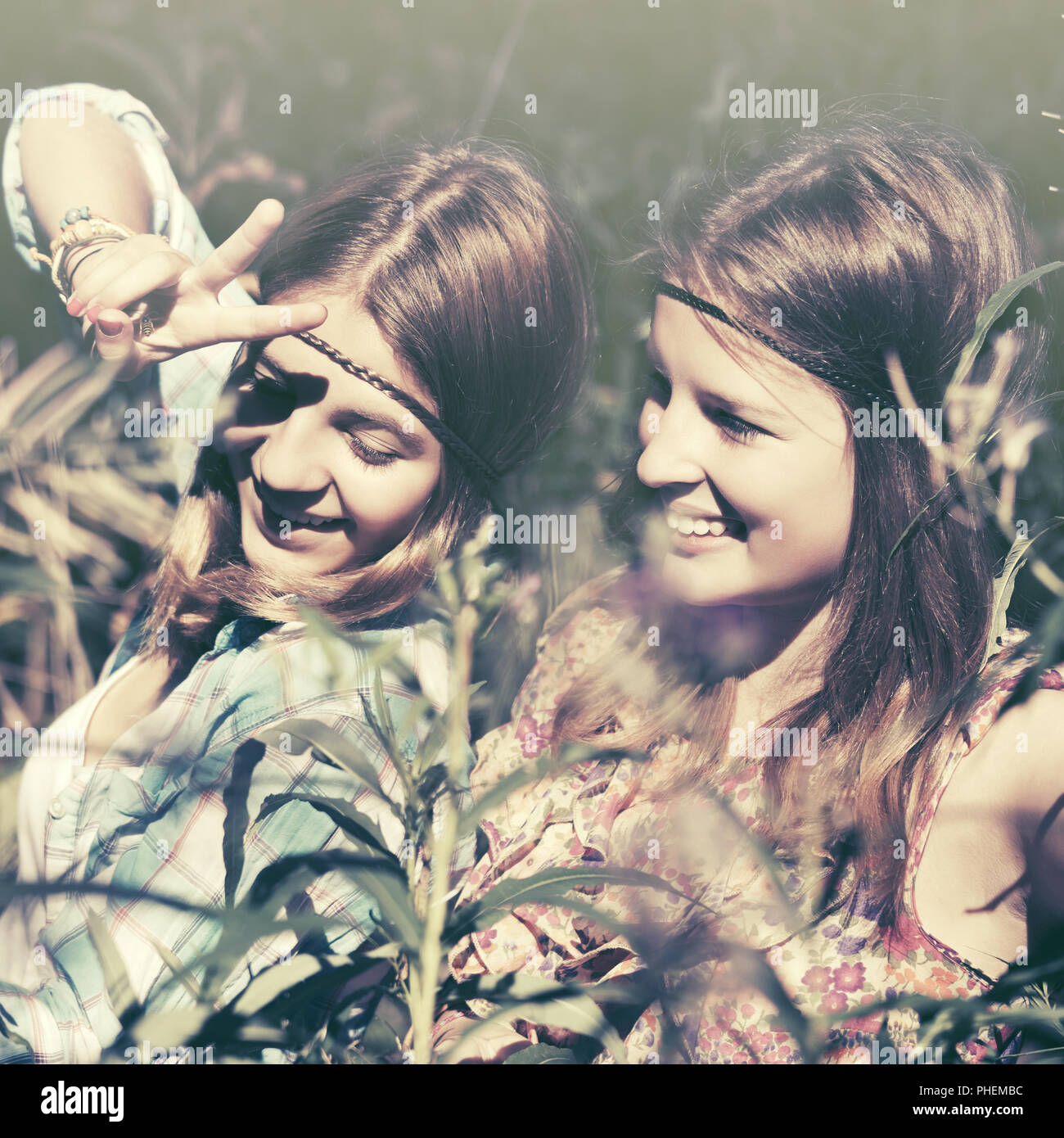 Two happy teen girls in a summer forest Stock Photo - Alamy