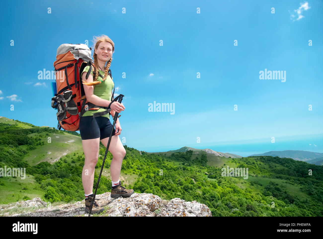 Hiking woman with backpack Stock Photo - Alamy