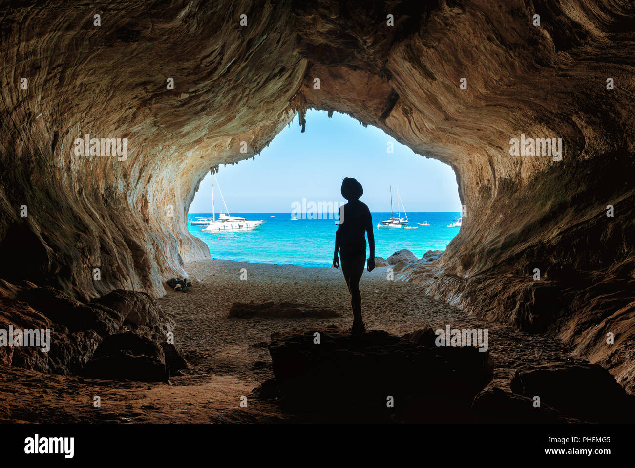 A man in the big cave Stock Photo - Alamy