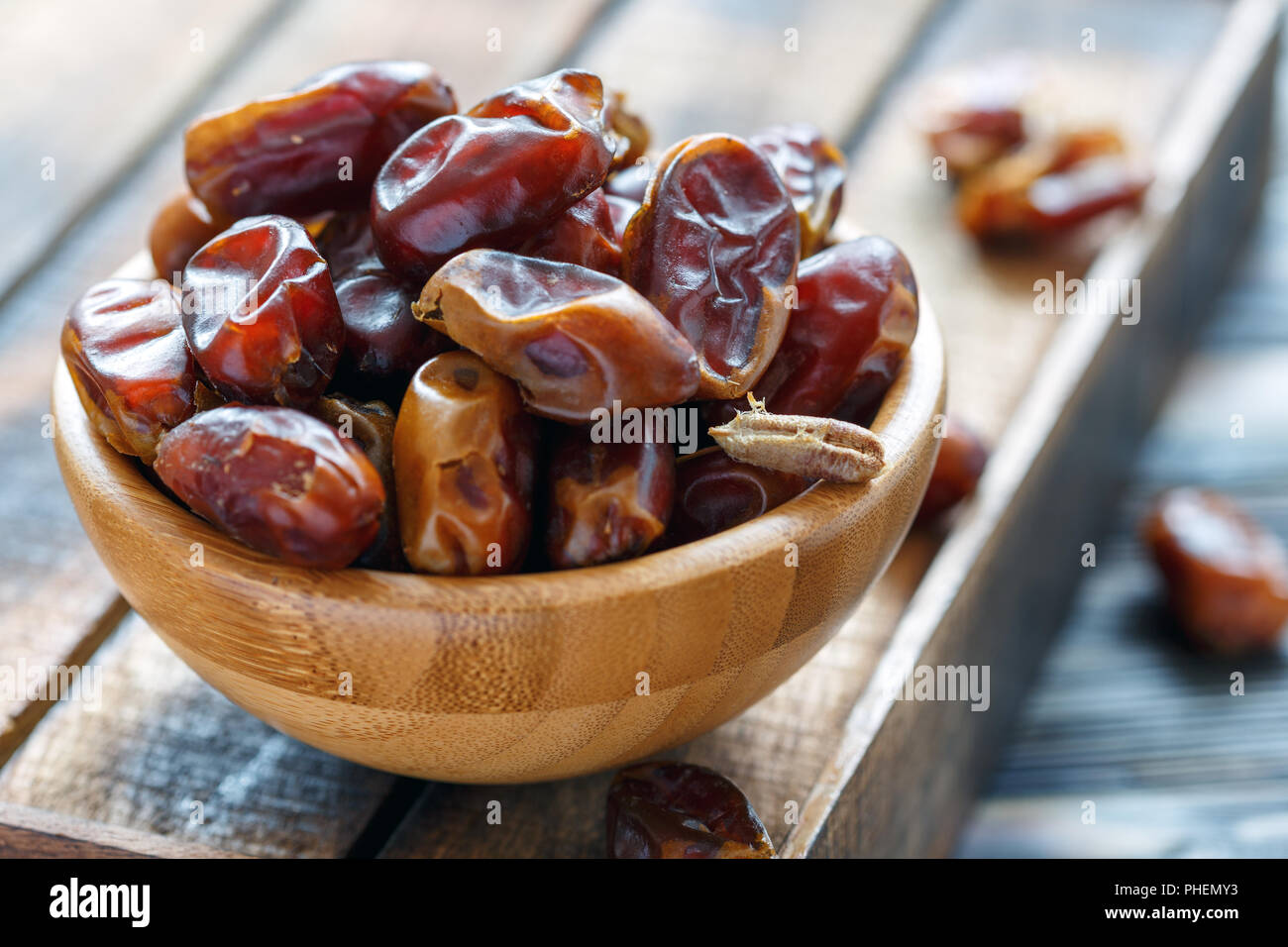 Delicious dried dates in a wooden bowl Stock Photo - Alamy