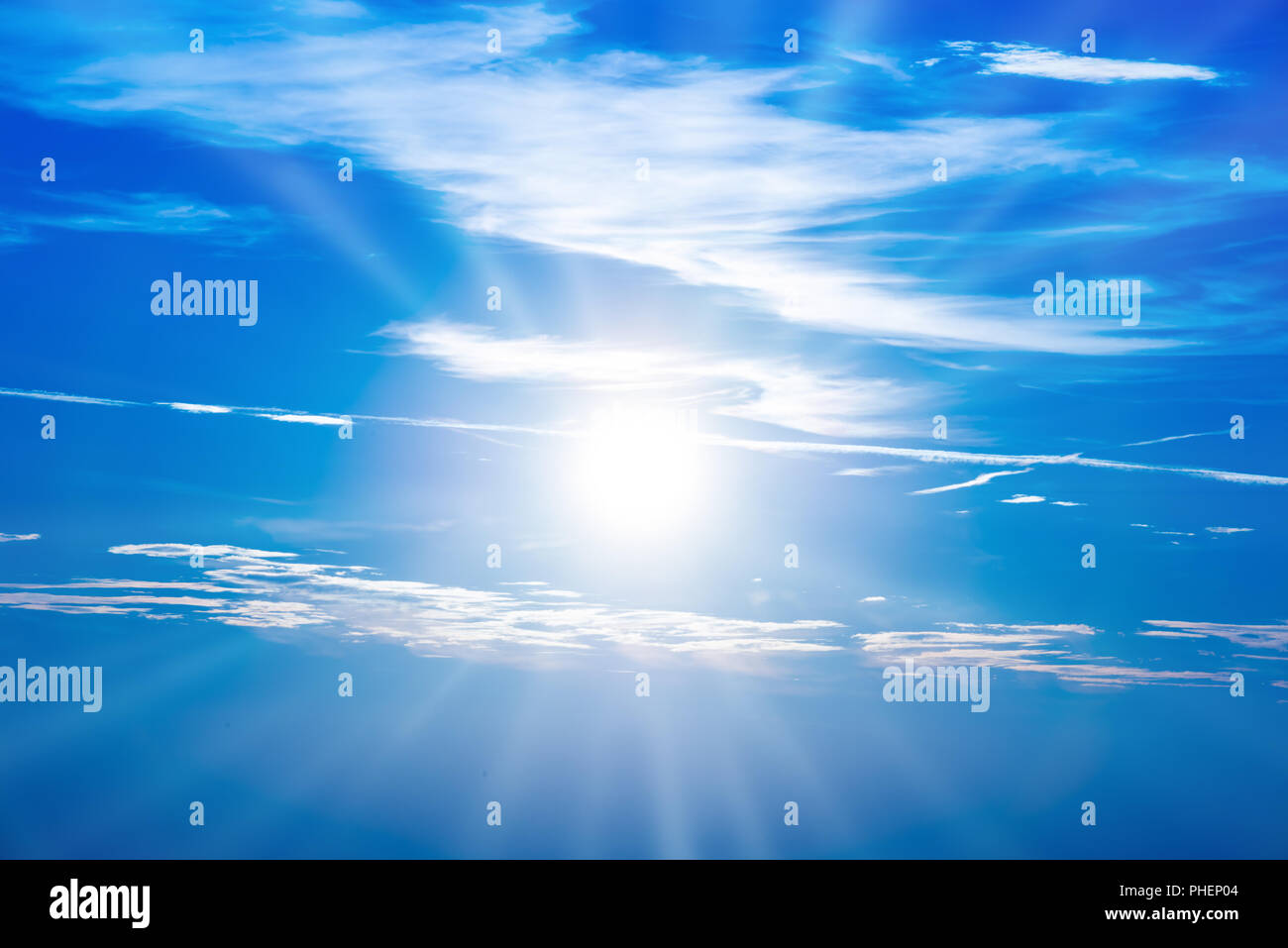 Sunset in the sky with blue clouds Stock Photo - Alamy
