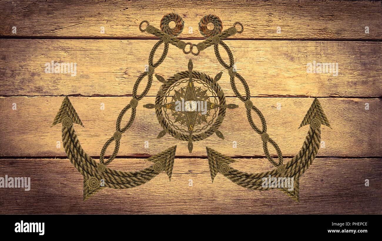 Compass anchor wheel on wood Stock Photo - Alamy