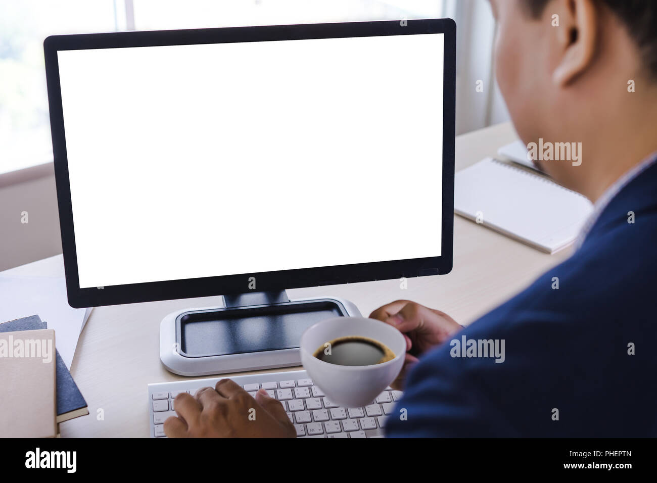man of business man hand working on laptop computer blank white screen ...