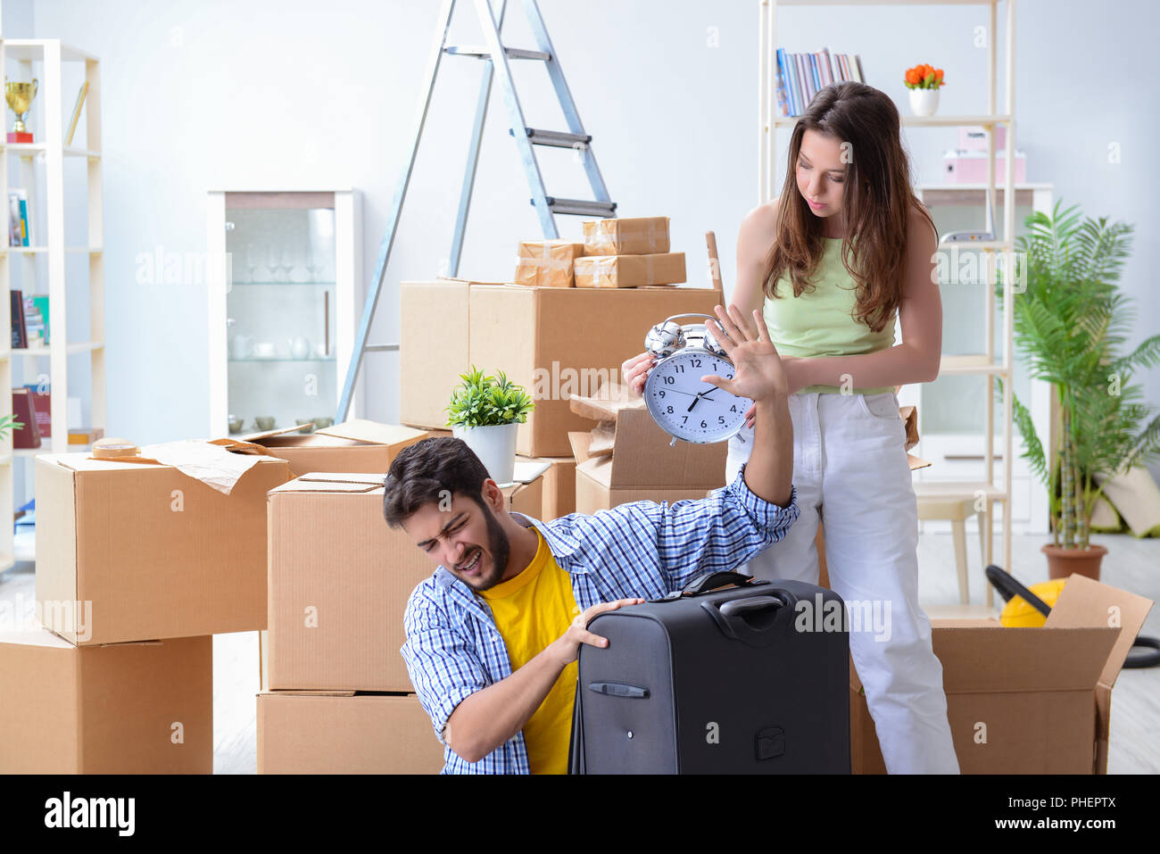 Young family unpacking at new house with boxes Stock Photo - Alamy