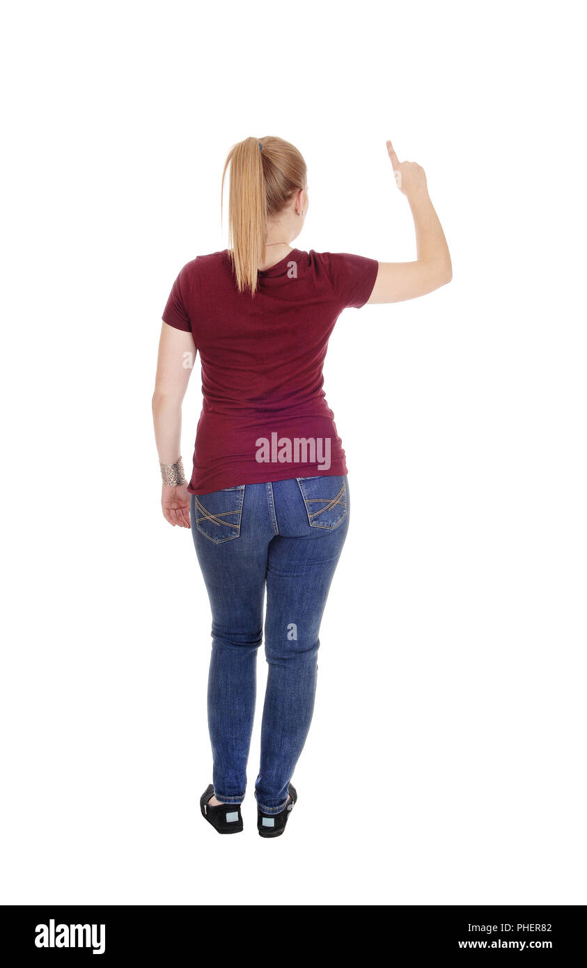 Woman standing from back with finger up Stock Photo - Alamy