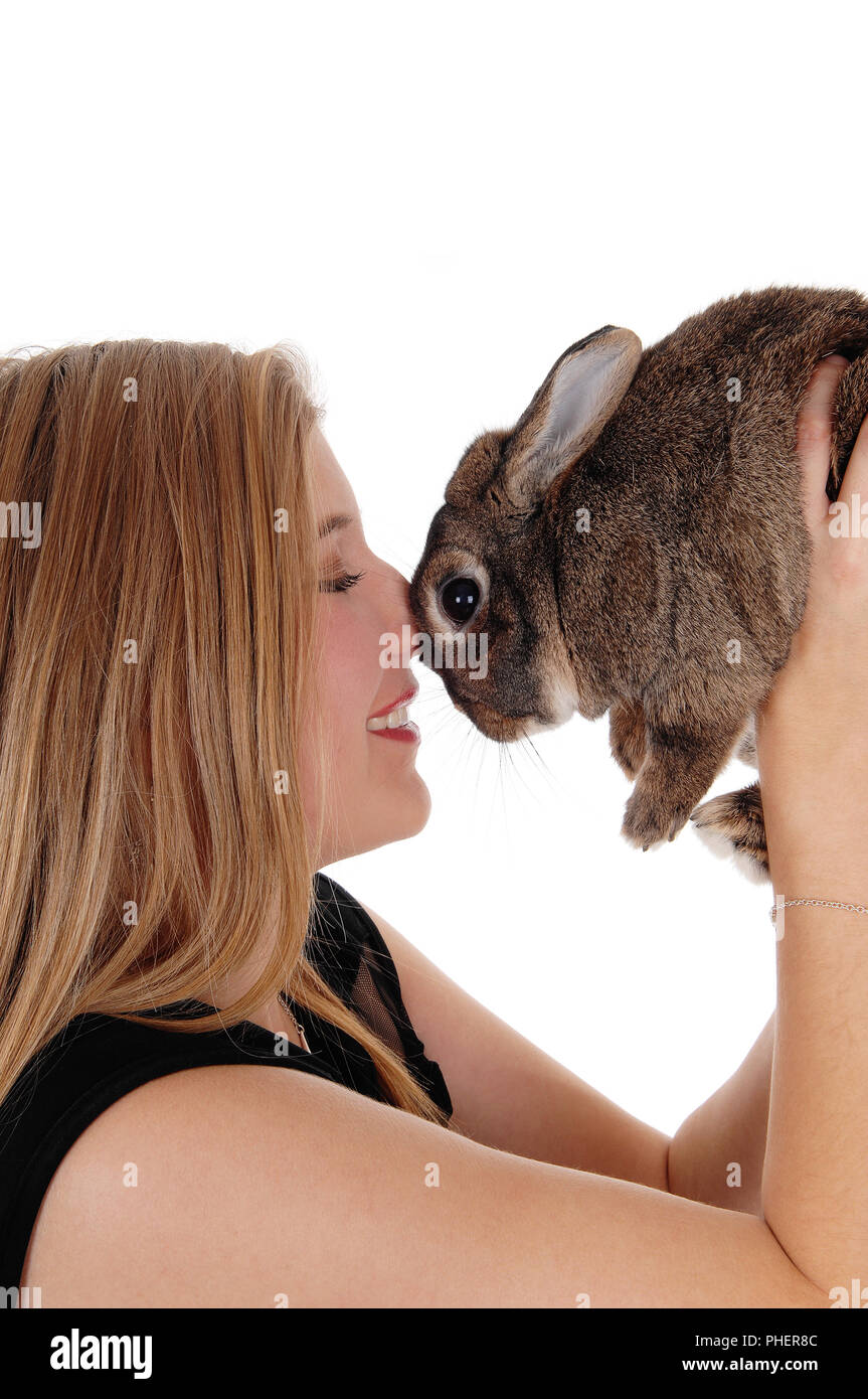 Young woman holding up a small rapid Stock Photo - Alamy