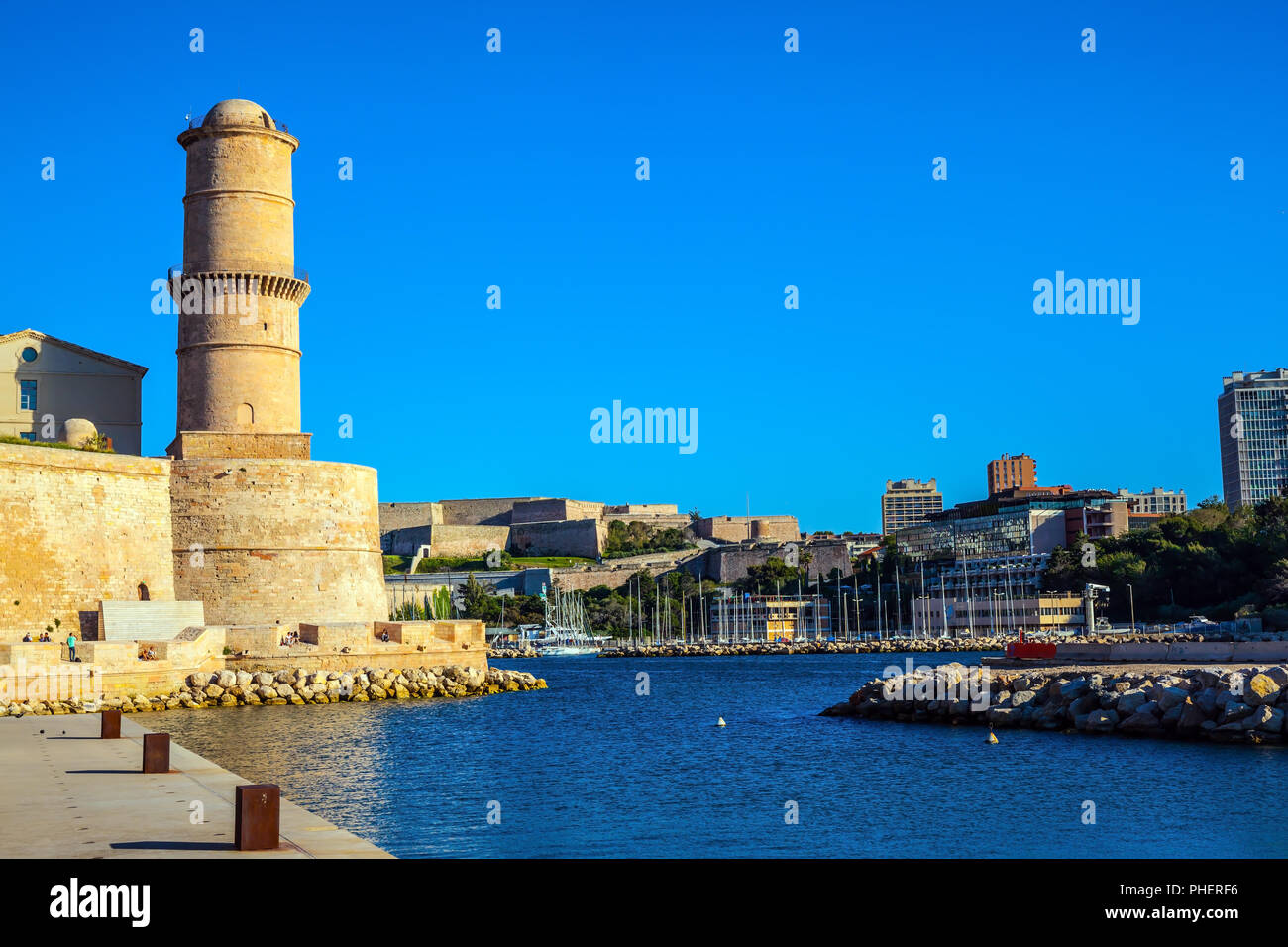Watchtower is reflected in the blue water Stock Photo - Alamy