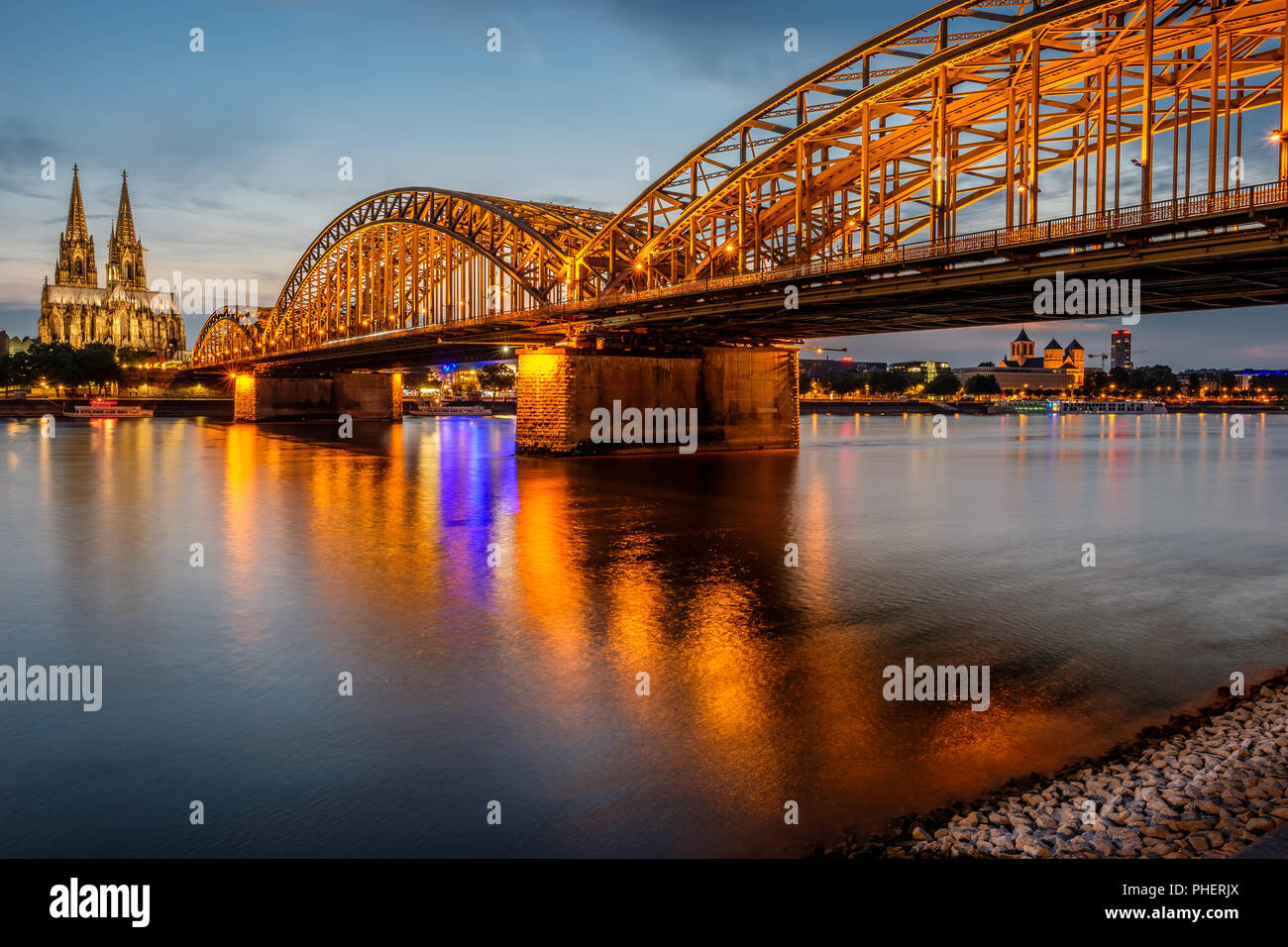 Cologne Cathedral and Hohenzollern Bridge at night, Germany Stock Photo ...