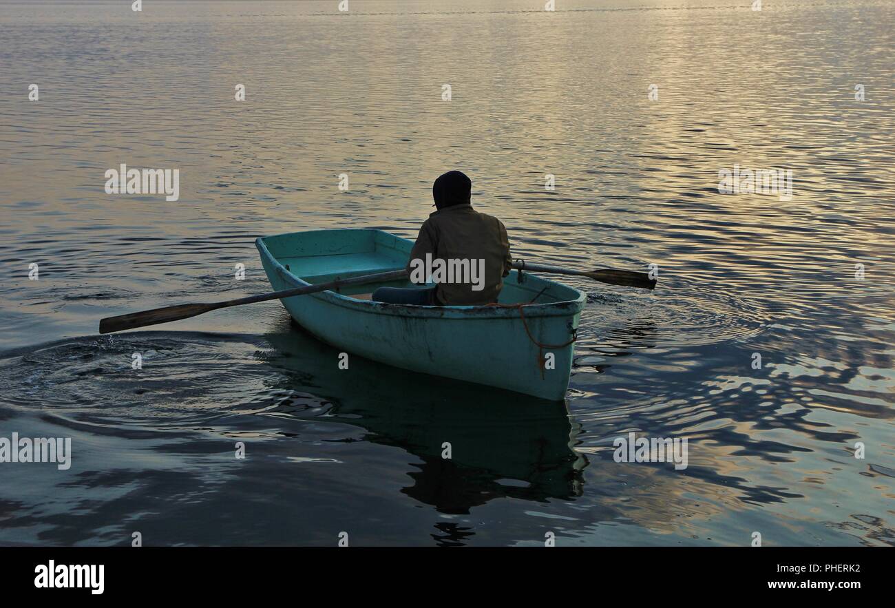Rowing boat in dusk hi-res stock photography and images - Alamy
