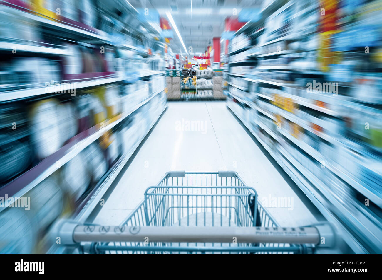 shopping cart and supermarket background Stock Photo - Alamy