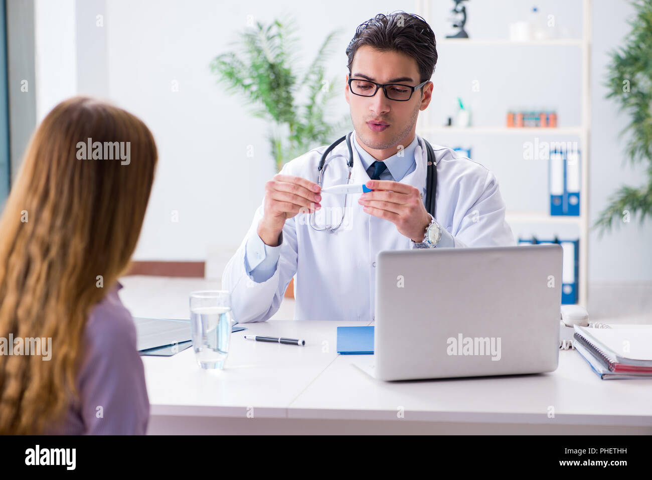 Patient visiting doctor for medical check-up in hospital Stock Photo ...
