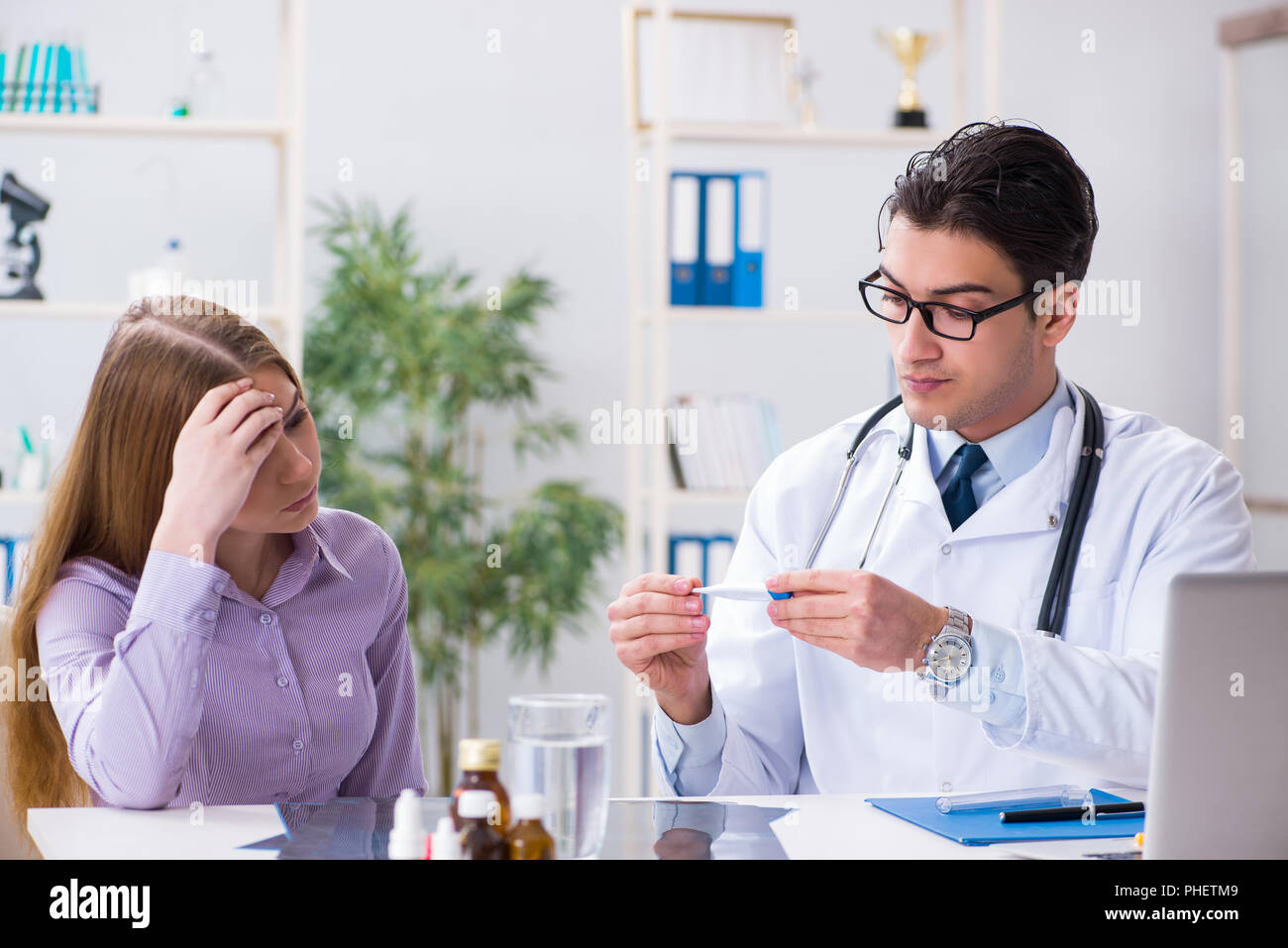 Patient visiting doctor for medical check-up in hospital Stock Photo ...