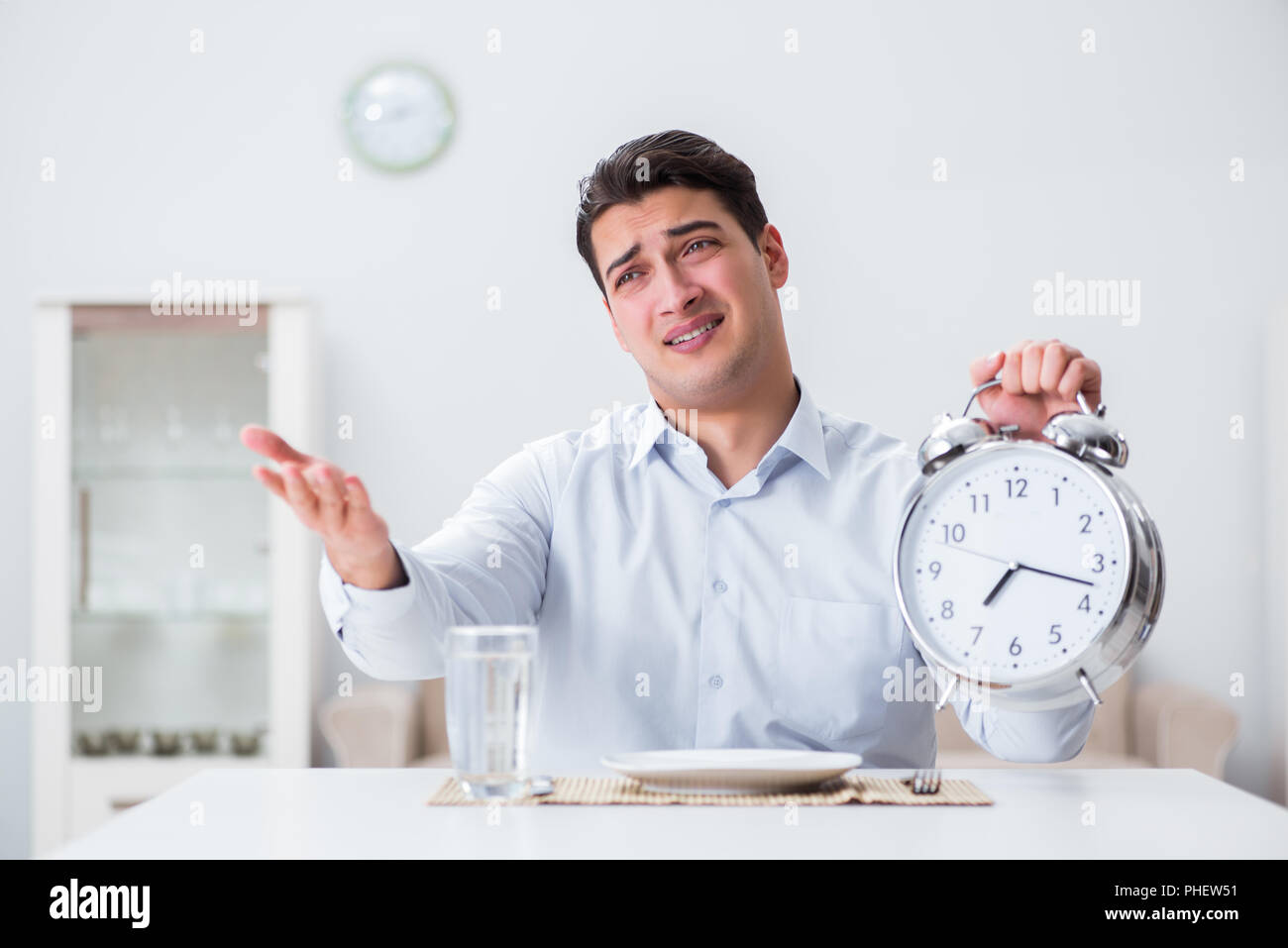 Angry man waiting food in hi-res stock photography and images - Alamy