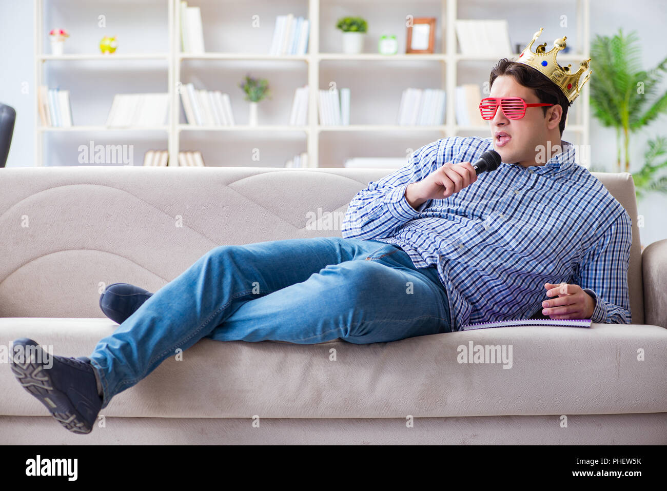 Funny man singing songs in karaoke at home Stock Photo - Alamy