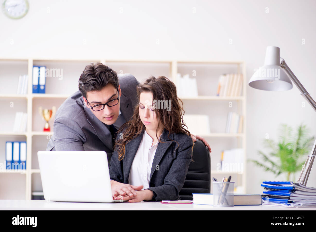 Unhappy boss having a chat with his secretary Stock Photo - Alamy