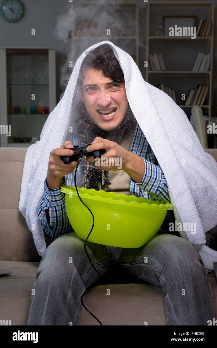 Sick man doing inhalation at night in home Stock Photo - Alamy