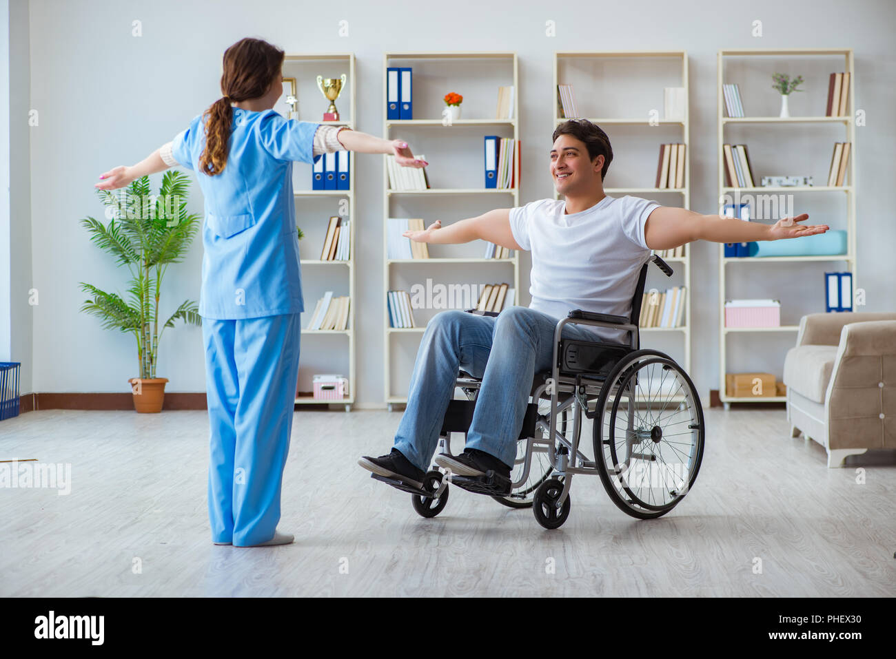 Patient undergoing rehabilitation recovery programme with doctor Stock ...